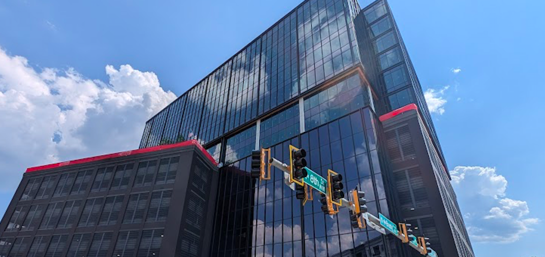 Renderings vs. Reality: Glassy mixed-use tower nears completion ...